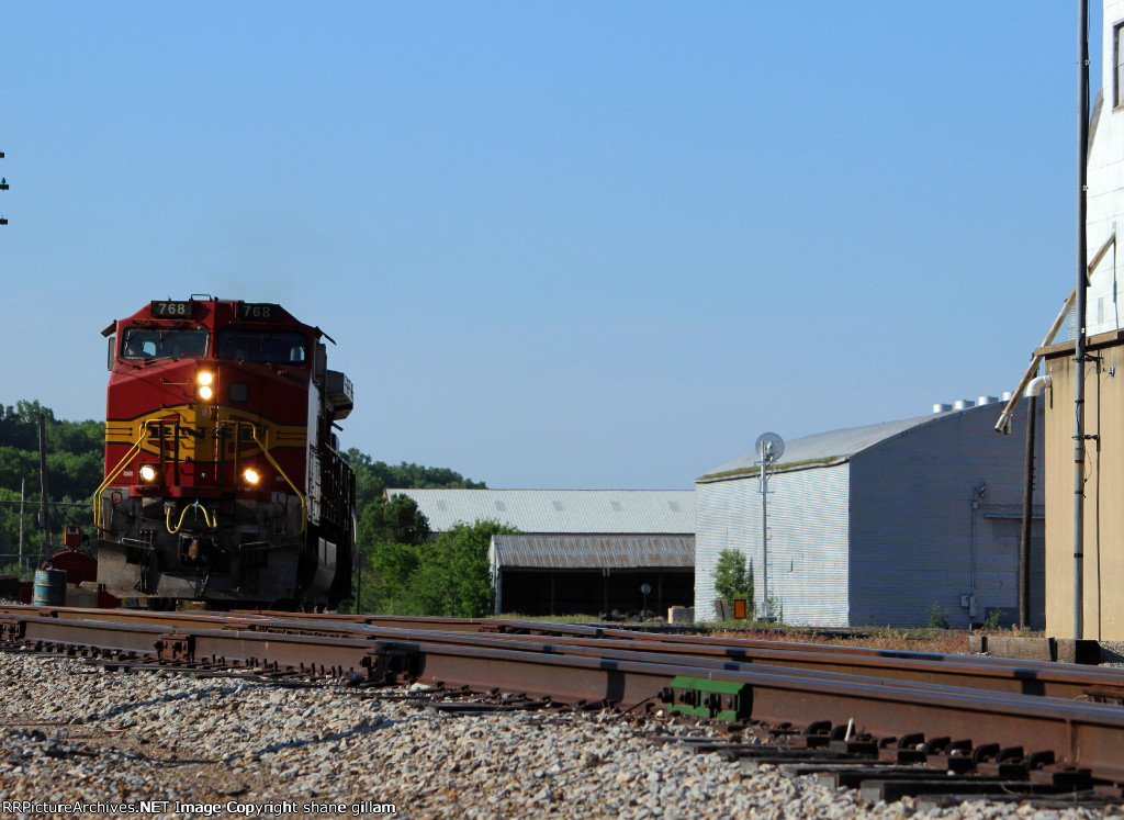 BNSF 768 leans on the old side track droping 2 cars off.